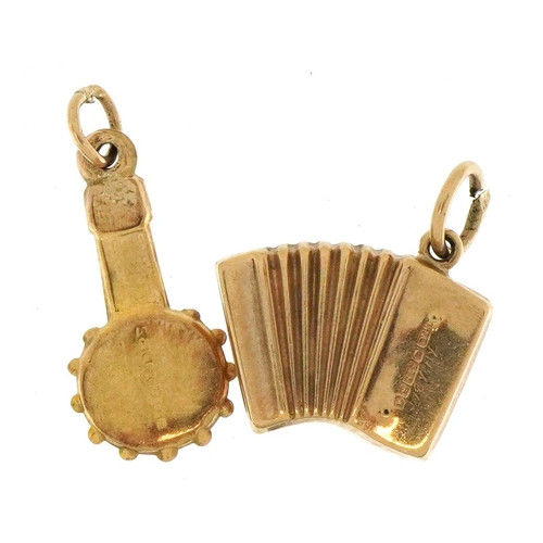 Two 9ct gold musical instrument charms comprising guitar and accordion ...