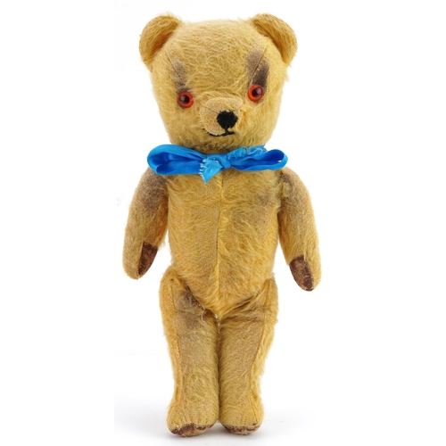 Vintage golden teddy bear with beaded eyes and articulated limbs, 30cm high