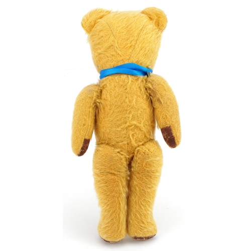 Vintage golden teddy bear with beaded eyes and articulated limbs, 30cm high