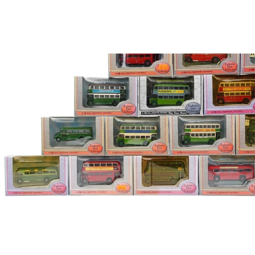 Twenty Exclusive First Editions 1:76 scale diecast model buses with boxes
