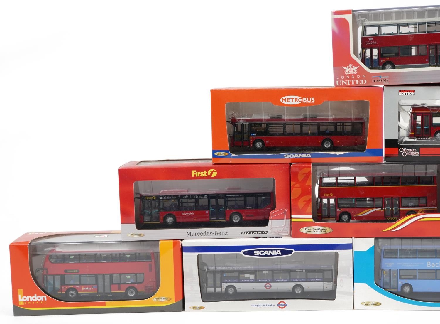 Twelve diecast model buses with cases and boxes including Scania ...