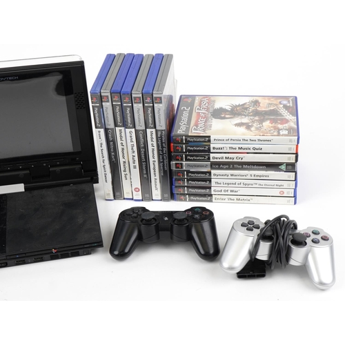 Sony PlayStation 2 slimline games console with three controllers, a ...