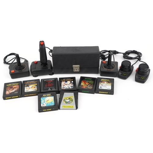 Collection of vintage Atari games console controllers and games ...