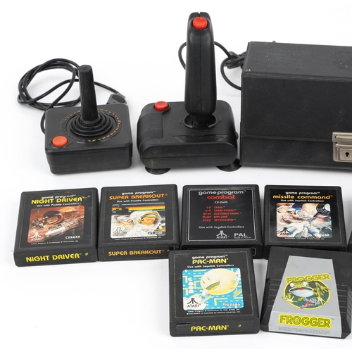 Collection of vintage Atari games console controllers and games ...