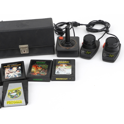 Collection of vintage Atari games console controllers and games ...