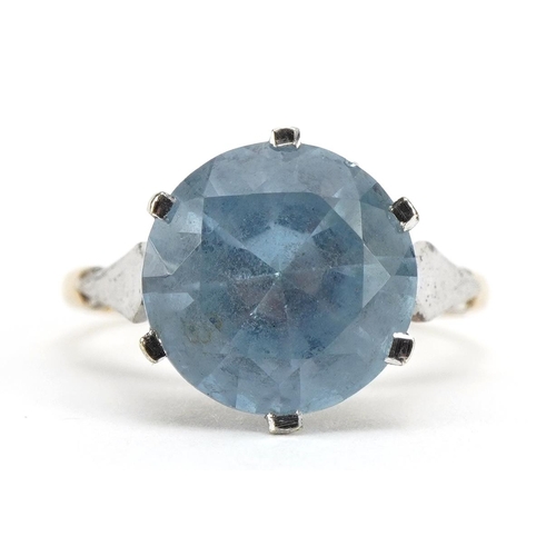 9ct gold blue stone solitaire ring, possibly topaz, the stone ...