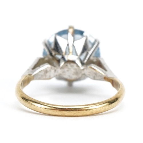 9ct gold blue stone solitaire ring, possibly topaz, the stone ...