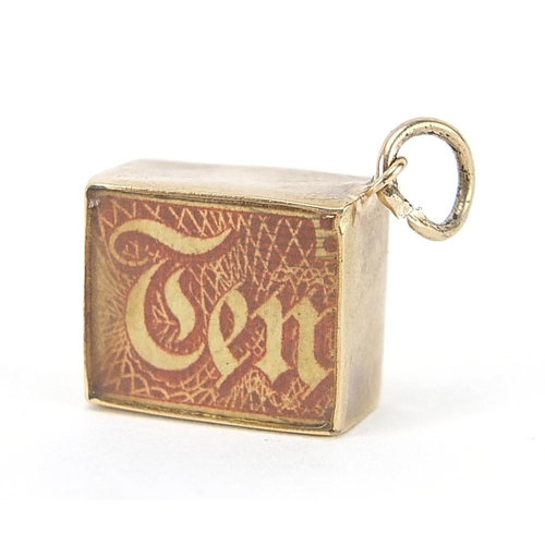 9ct gold emergency ten shilling note charm, 1.3cm wide, 2.2g