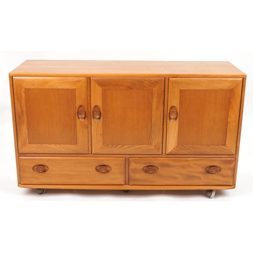 Ercol Windsor light elm sideboard with three cupboard doors and three ...