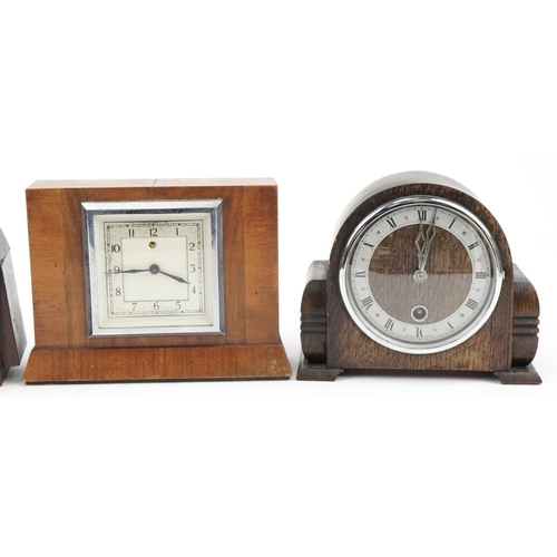 Four Art Deco walnut and oak mantle clocks including Temco, Davall and ...