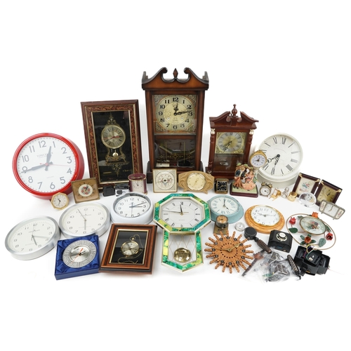 Large collection of clocks including wall clocks, mantle clocks and ...