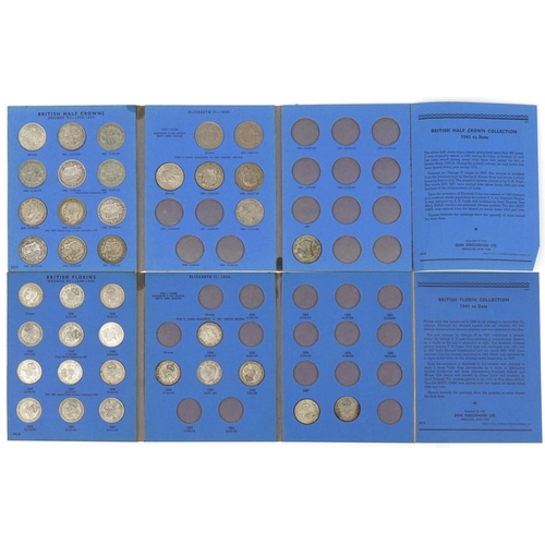 Two Great Britain coin folders with coins comprising florins and half ...