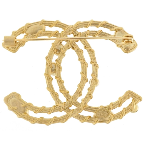 Chanel, vintage Chanel monogram brooch with box set with clear stones ...