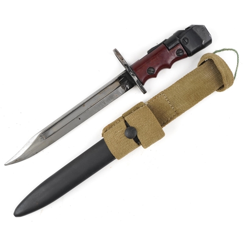 A British military interest bayonet with scabbard and canvas frog, 33cm ...