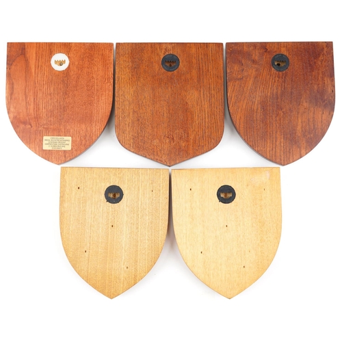 Four military interest aviation plaques with shield backs and a similar ...