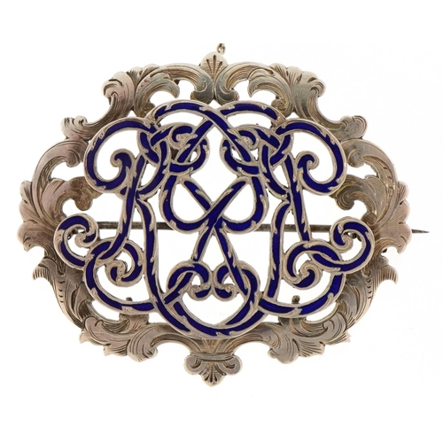 An unmarked silver and enamel monogram brooch, 6cm wide, 36.2g, housed ...