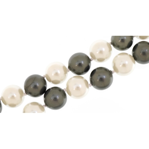 A metallic grey and white South Sea pearl necklace, each pearl ...