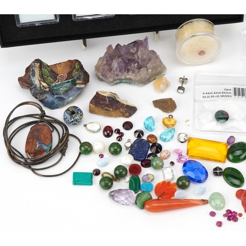 A large collection of loose semi precious stones including ruby, topaz ...