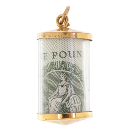 A 9ct gold mounted emergency one pound note charm, 2.6cm high, 2.6g.