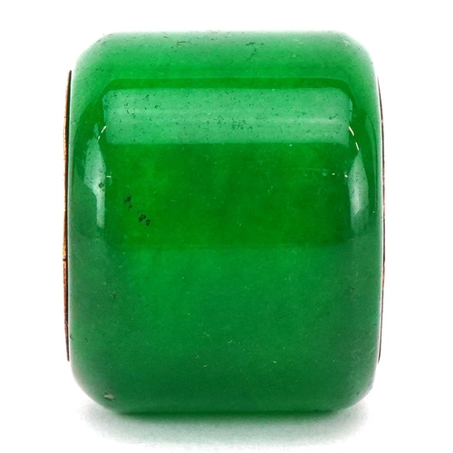 A Chinese silver gilt and green jade archer's ring, size Z, 2.9cm wide ...