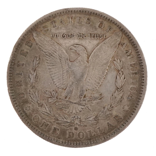An 1889 Morgan silver dollar, mint mark New Orleans.