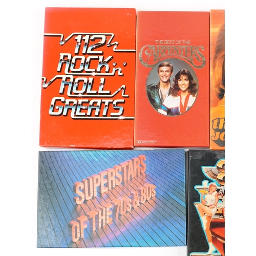 A collection of vintage tape cassette box sets including The Best of ...