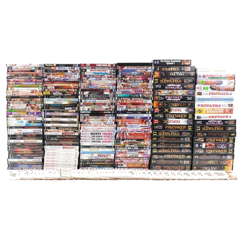 An extensive collection of adult entertainment DVDs and VHS cassettes.