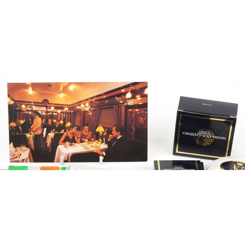 A collection of 1990s Orient Express railway memorabilia.