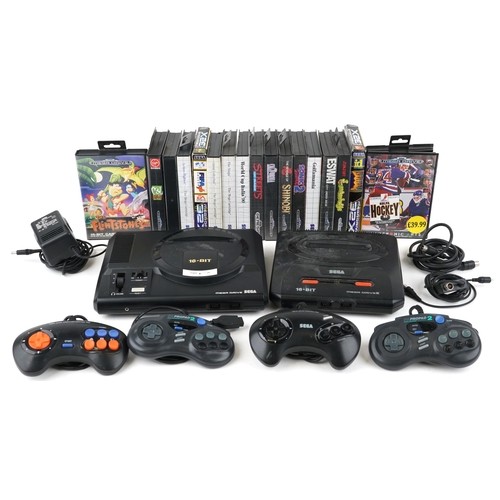 Vintage Sega games consoles with controllers and a selection of games ...