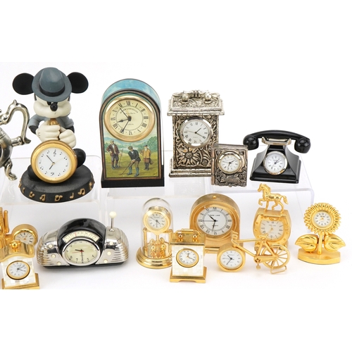 A collection of miniature decorative clocks in various forms, the ...