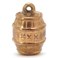 A 9ct gold charm in the form of a barrel, 1.1cm high, 0.8g.