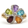 A 9ct gold diamond flower head ring set with semi precious stones ...