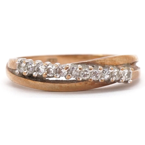 A 9ct gold diamond crossover half eternity ring, size N, 2.9g.
