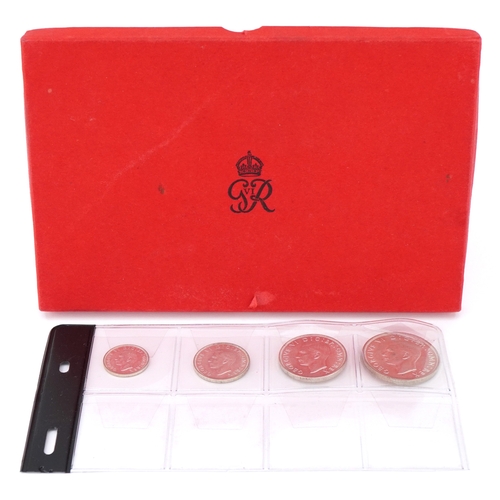 An uncirculated set of George VI 1941 silver coins comprising half ...