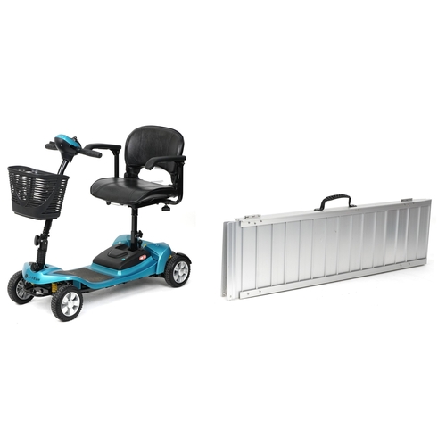 A Li-Tech mobility scooter finished in metallic green with black ...