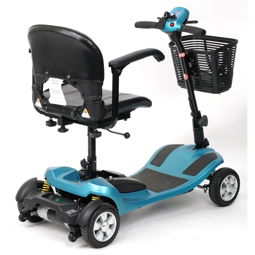 A Li-Tech mobility scooter finished in metallic green with black ...