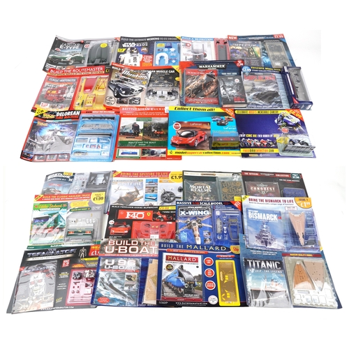 A collection of collectable magazines, predominantly model kits.