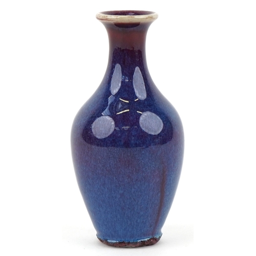 A Chinese Jun ware purple glazed pottery vase, 16.5cm high.