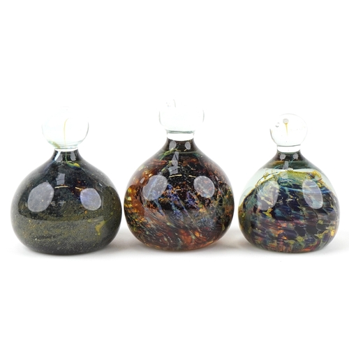 Three Mdina glass paperweights, each signed to the base, the largest ...