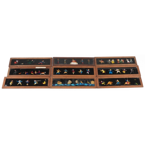 A collection of 19th century coloured magic lantern slides, each housed ...