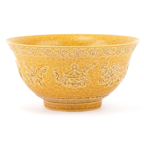 A Chinese porcelain bowl having a biscuit glaze, decorated in relief ...