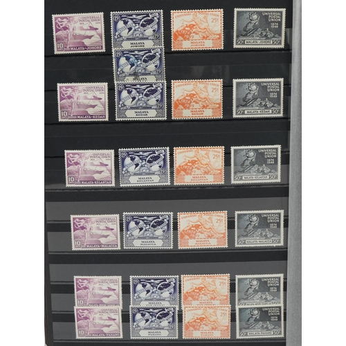 A large black stamps album containing a good quality range of mint and ...