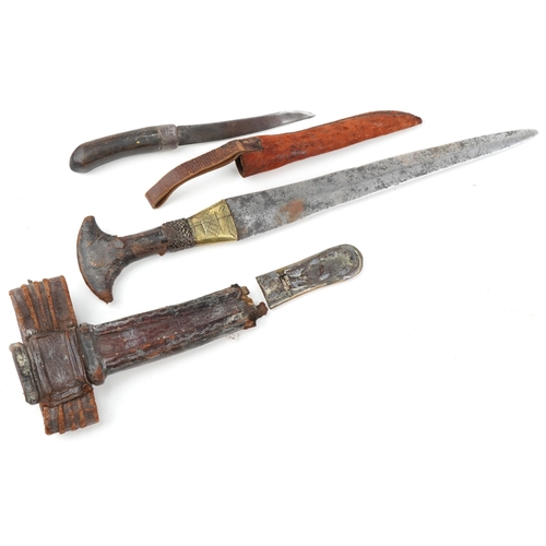 Two antique steel bladed daggers with leather sheaths, the largest 40cm in length.