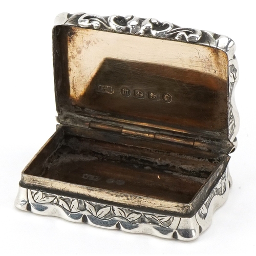 George Unite, a Victorian silver patch box with engraved decoration, Birmingham 1886, 3.7cm wide, 20