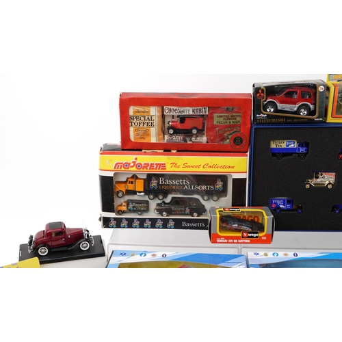 A large collection of diecast vehicles including Maisto Supercar ...
