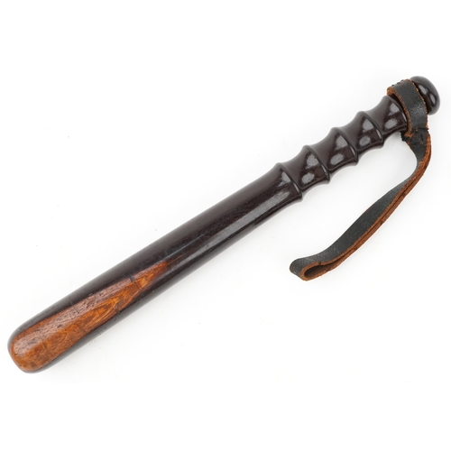A 19th century turned walnut Police truncheon with leather strap, 38cm ...