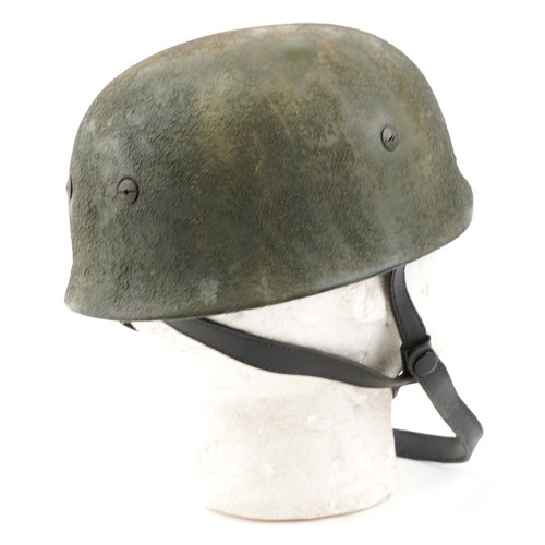 A German military style tin helmet.