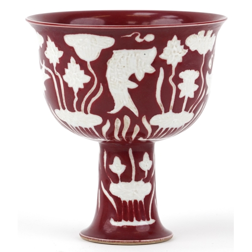 A Chinese porcelain iron red stem bowl incised with aquatic life ...