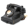 A vintage black Bakelite dial telephone, the handset numbered 164 56.