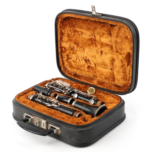 A Corton ebonised five piece clarinet housed in a fitted case, numbered ...